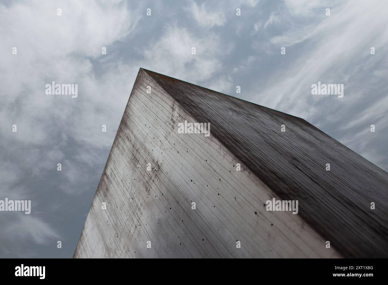 Concrete cube on cloudy sky background Stock Photo - Alamy