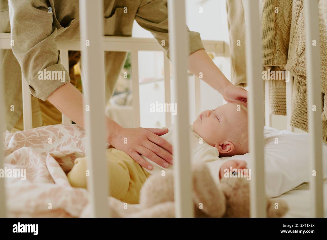 Caring for Newborn in Cozy Nursery Setting Stock Photo - Alamy
