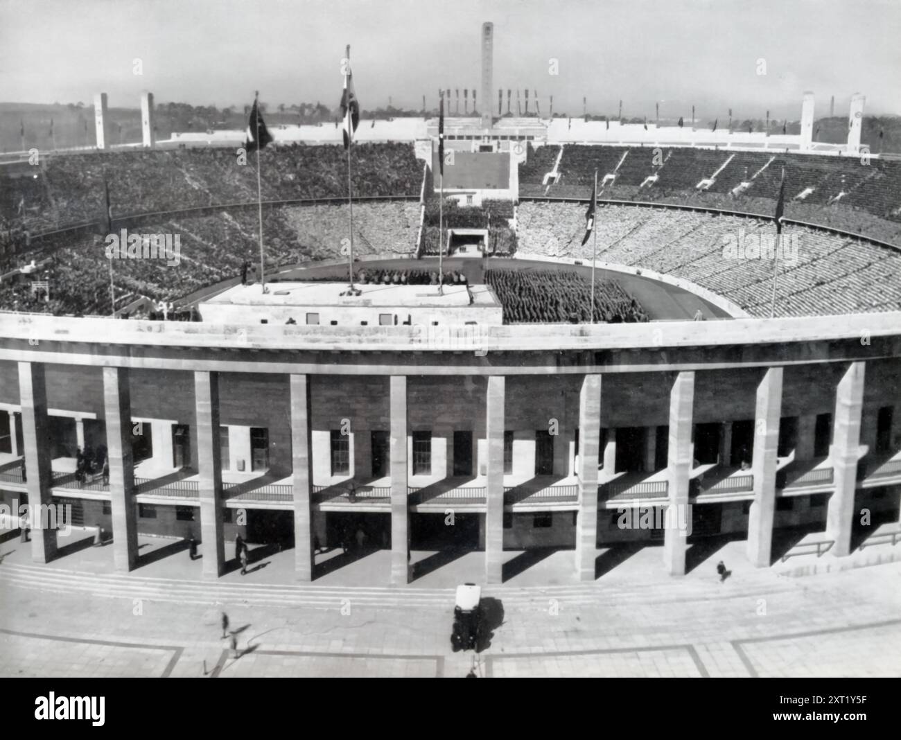 The photograph shows the Olympiastadion in Berlin, the centerpiece of ...