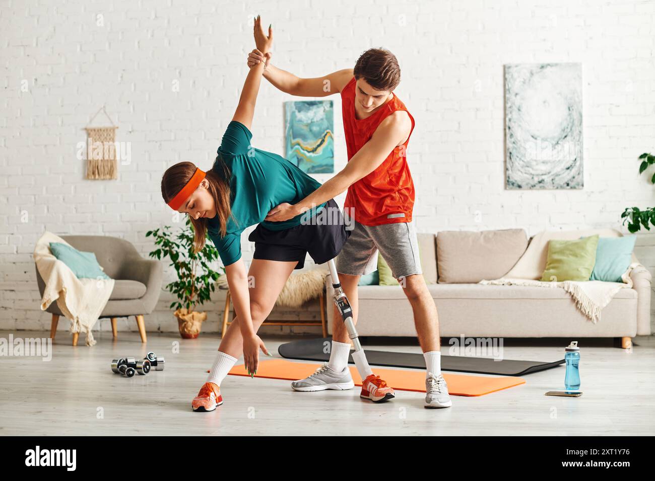 Woman with prosthetic leg stretches with boyfriend during home workout ...