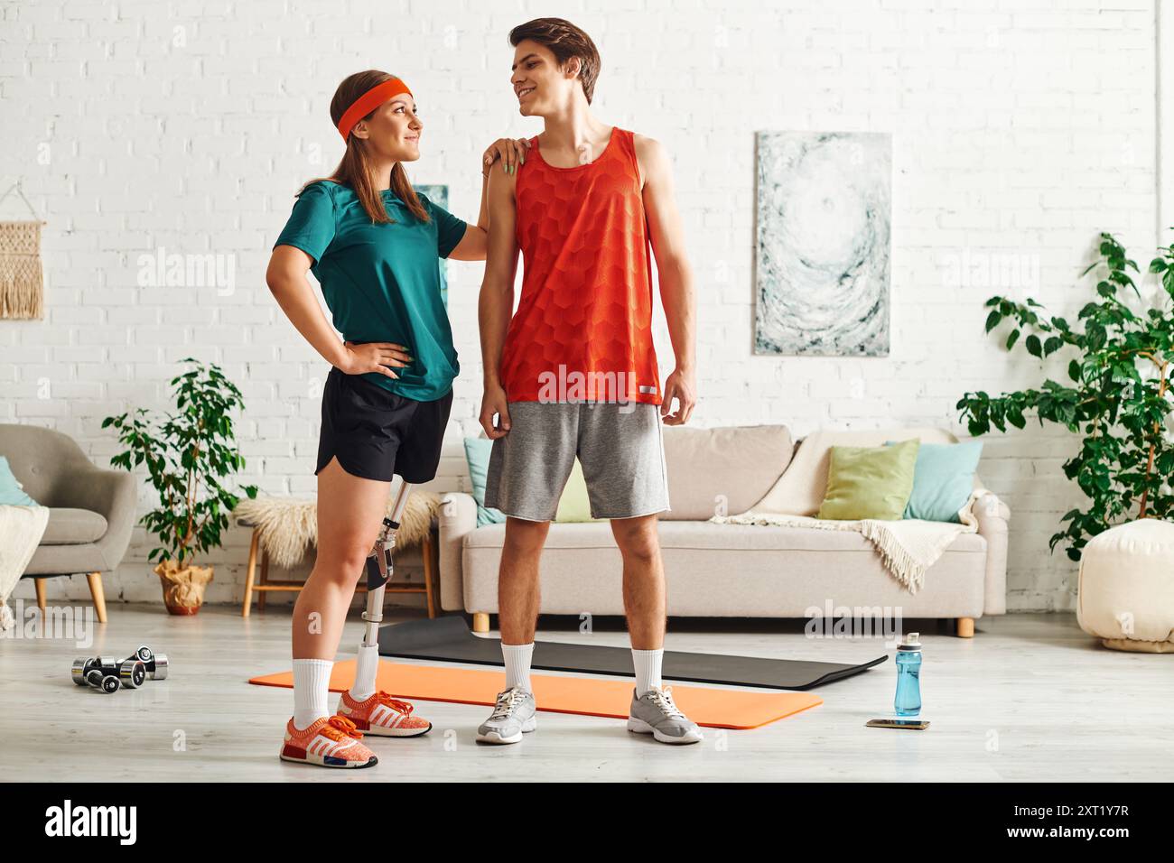 A woman with a prosthetic leg and her boyfriend working out together in ...