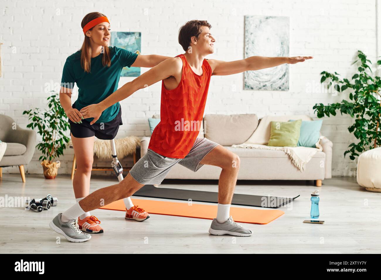 A woman with a prosthetic leg helps her boyfriend with his workout ...