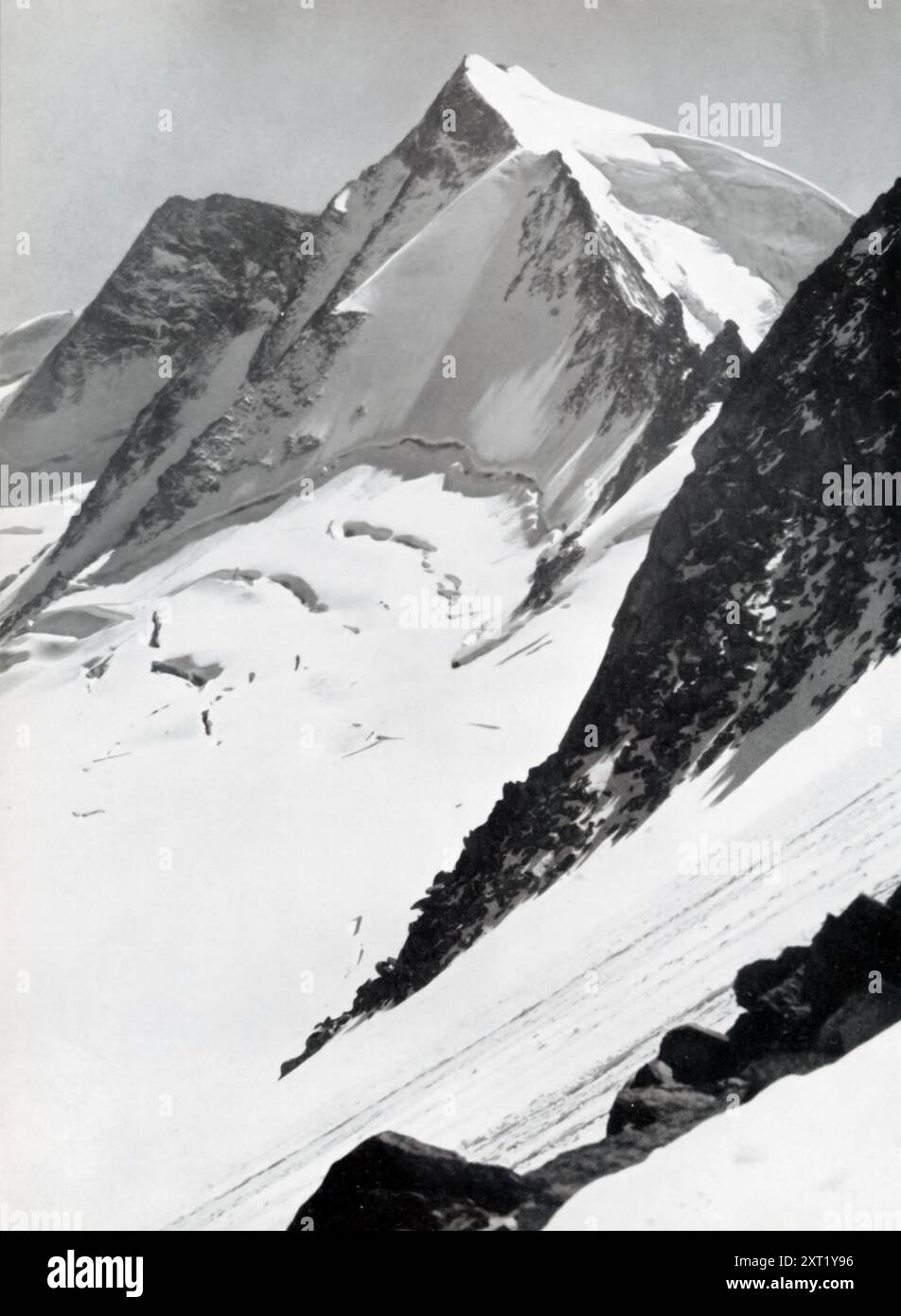 The photograph captures the snow-covered Großes Möseler in the ...
