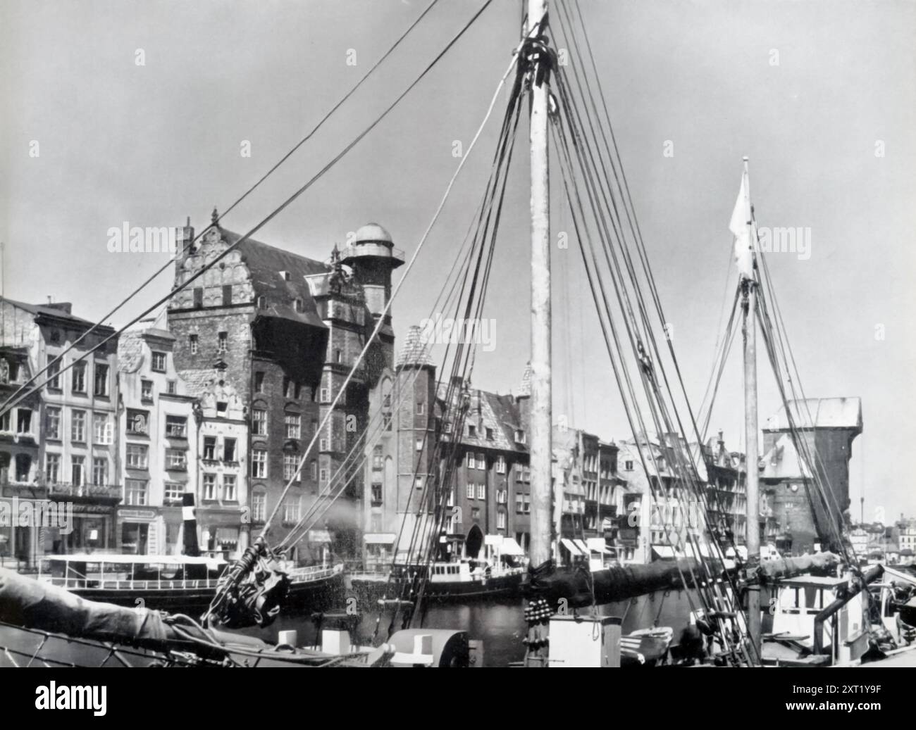 The photograph shows a traditional Hanseatic town on the Baltic Sea in Germany, with sailboats ...
