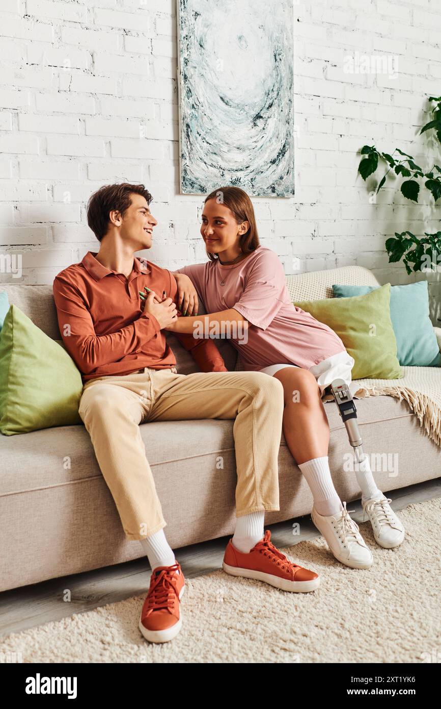 A couple, a woman with a prosthetic leg and her boyfriend, share a ...