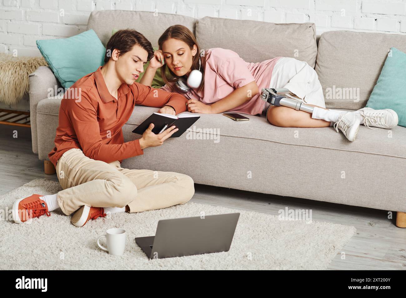 Woman resting sofa leg up hi-res stock photography and images - Alamy
