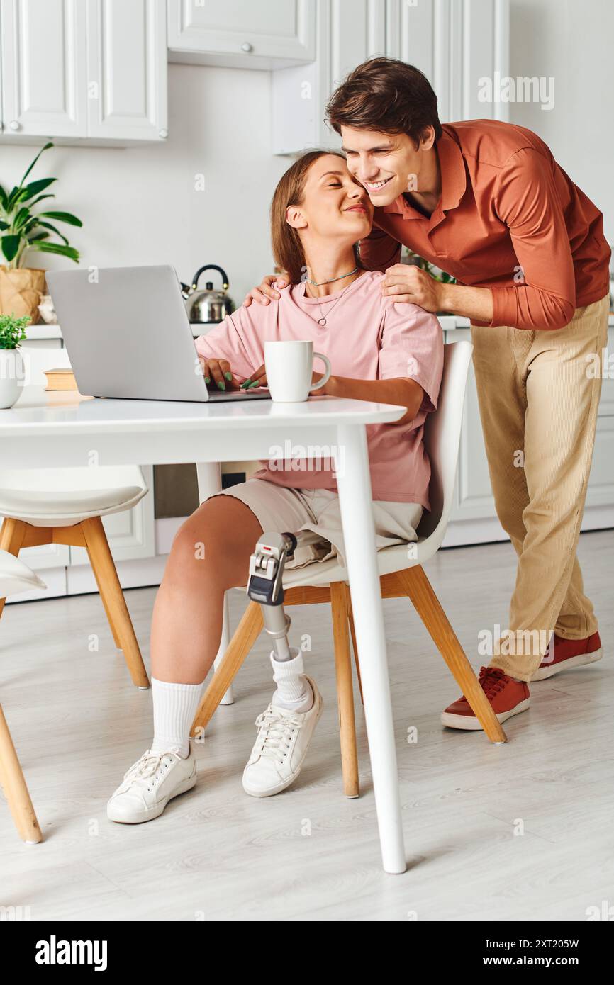 A woman with a prosthetic leg sits at a table with her boyfriend, who ...