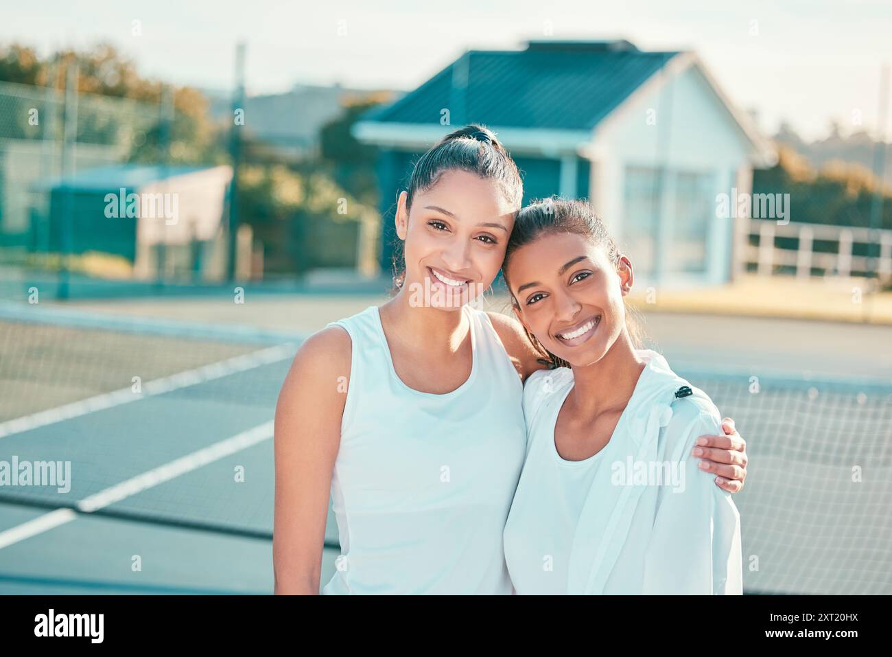 Tennis, happy and portrait of women hug on court for teamwork, support ...