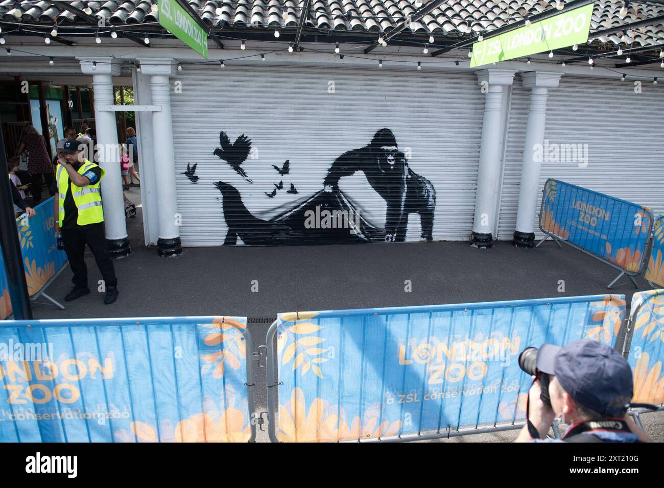 London, UK. 13 Aug 2024. People take photos of Street artist Banksy's ...
