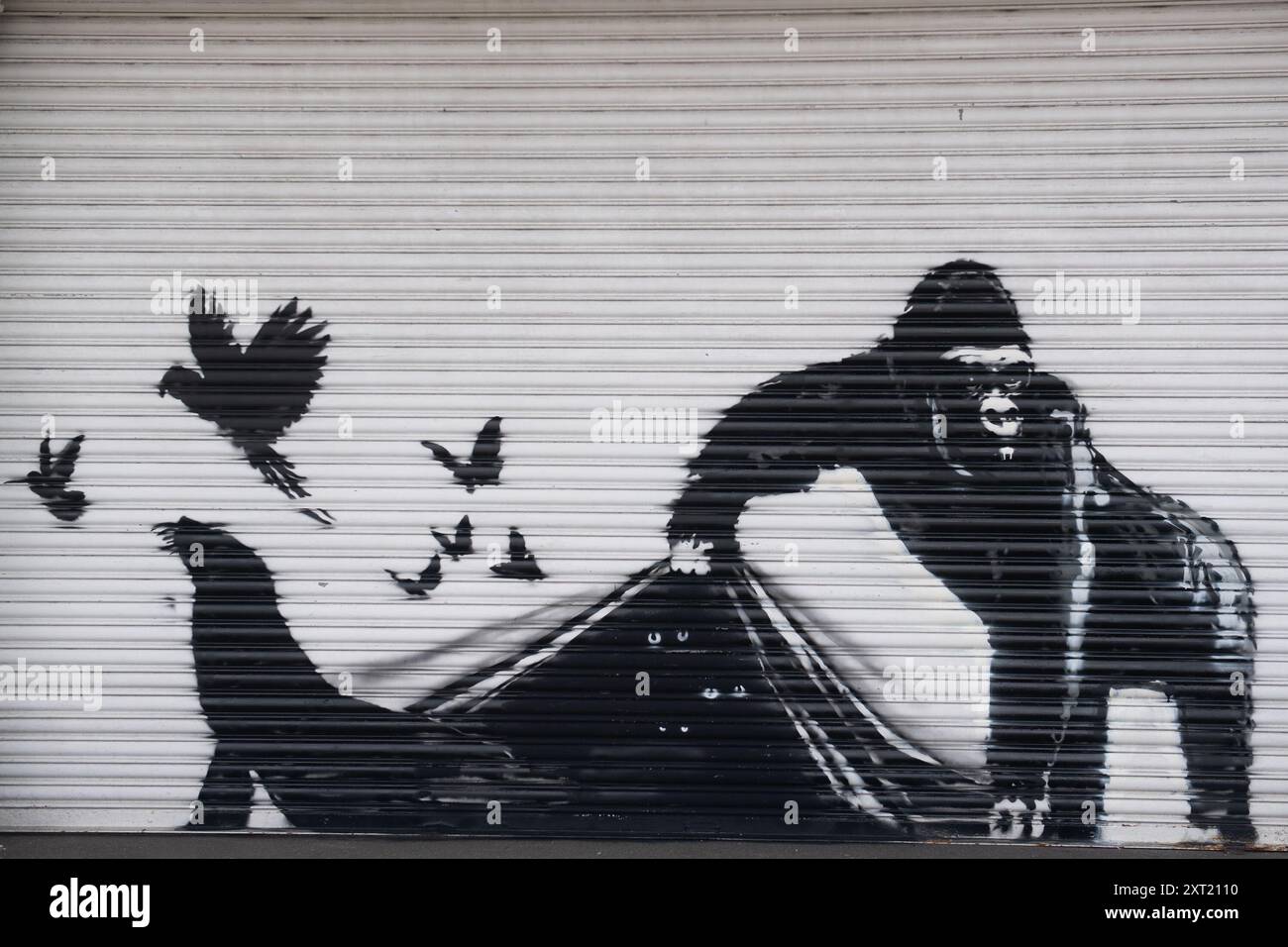 London, UK. 13 Aug 2024. People take photos of Street artist Banksy's ...