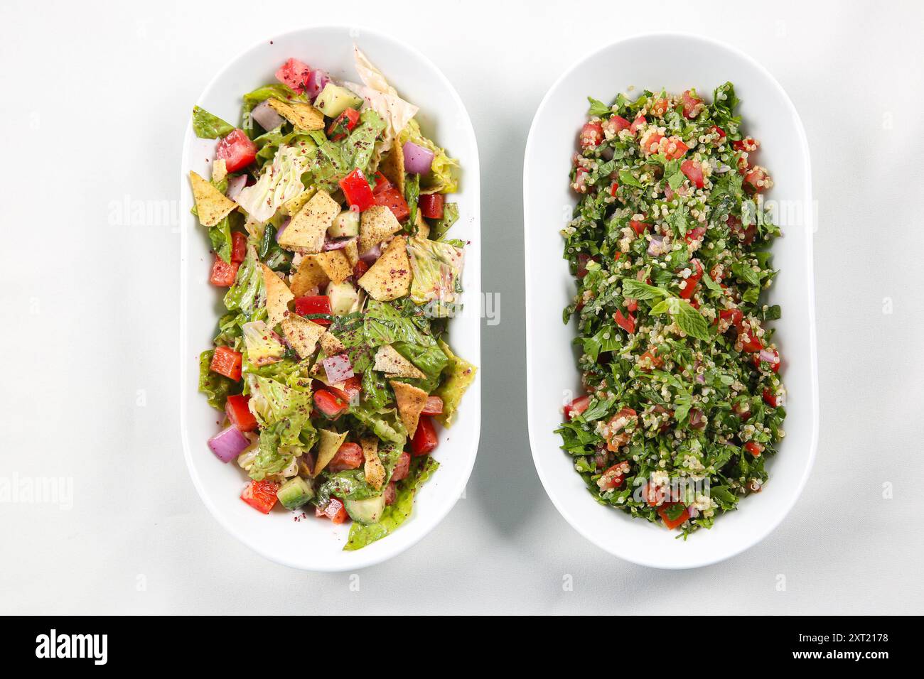 Blow of traditional Arabic salad Fattoush and tabbouleh on a white ...