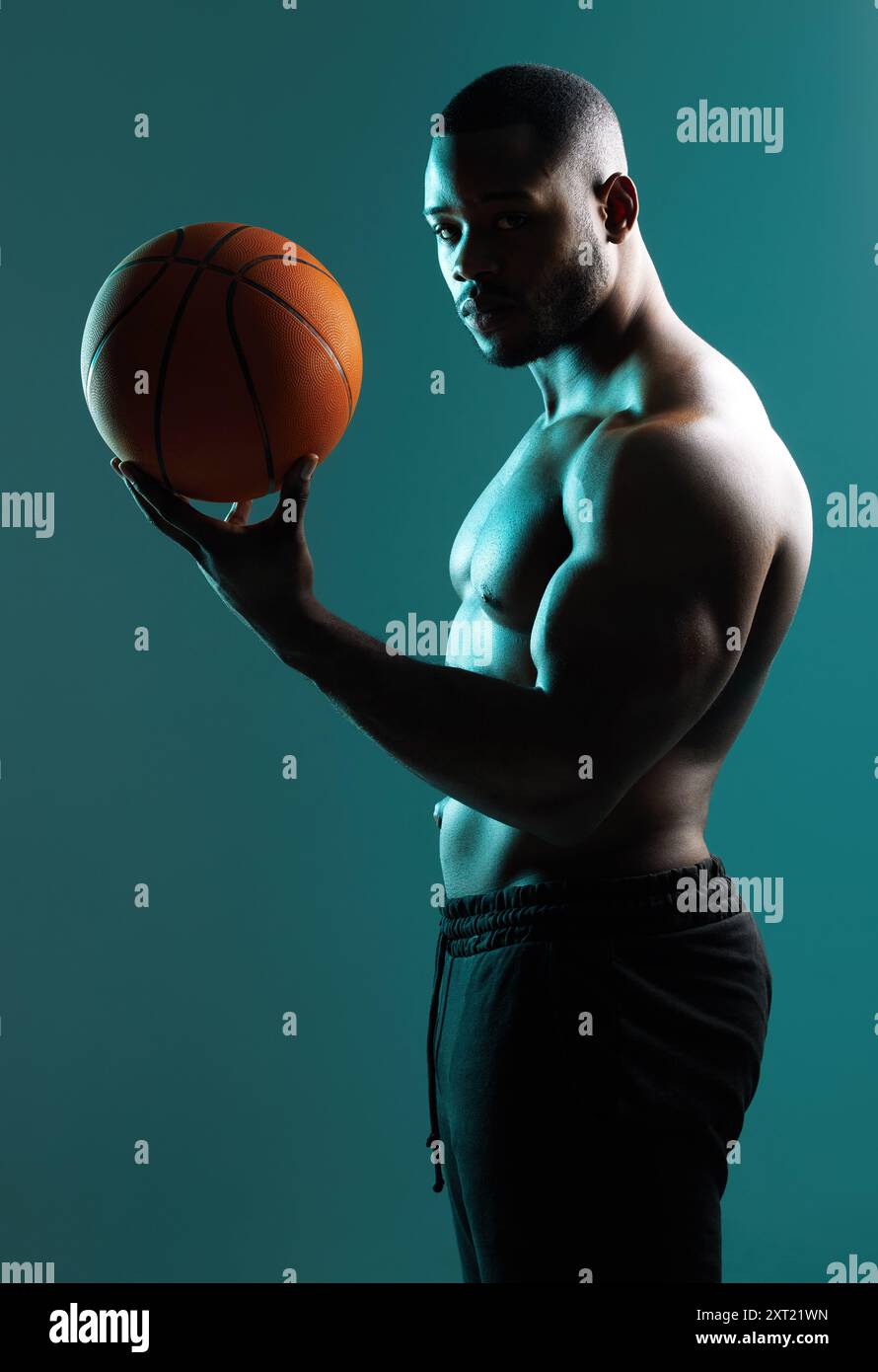 Black man, basketball and sport for portrait in studio background ...