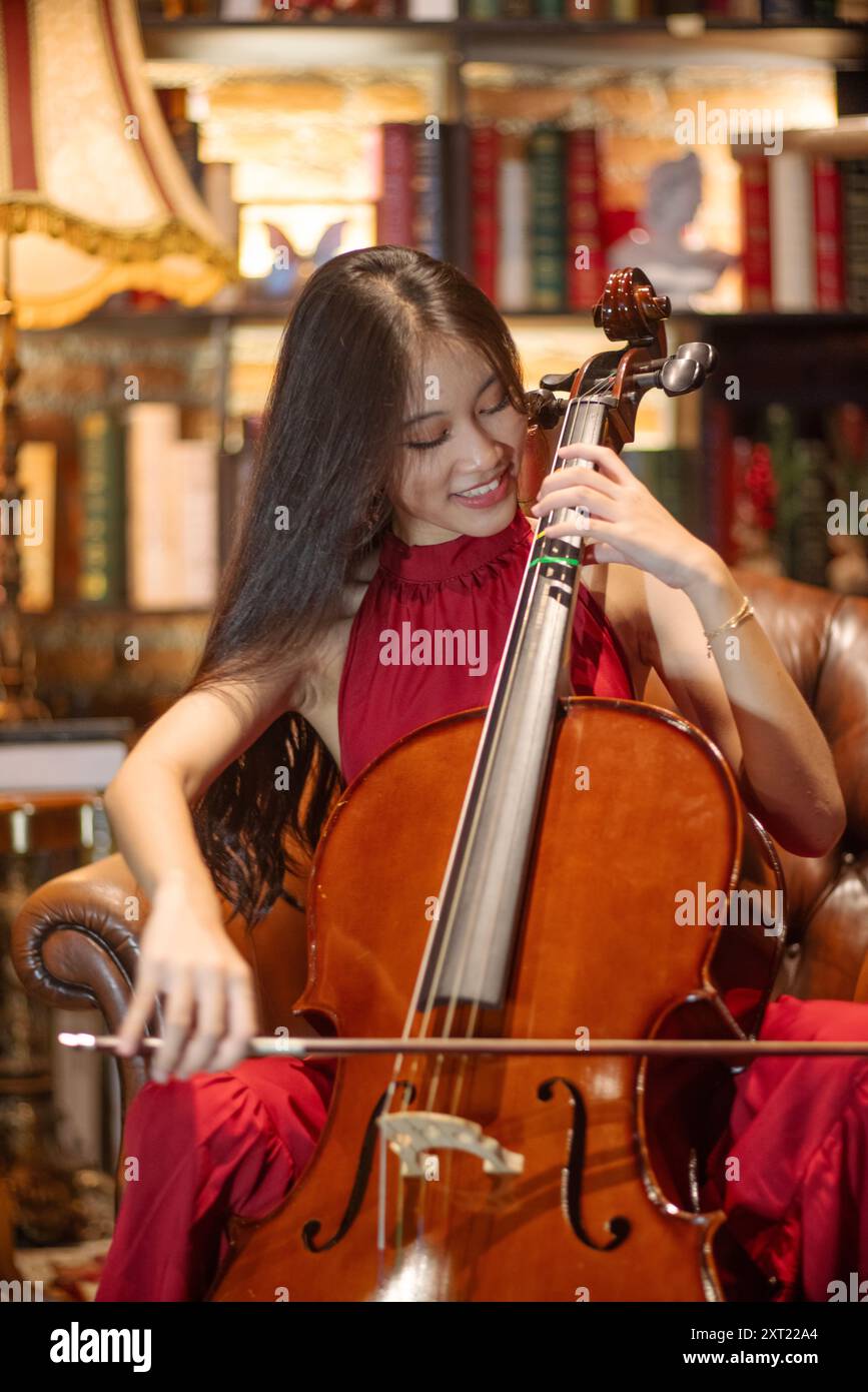 Asian girl playing cello hi-res stock photography and images - Alamy