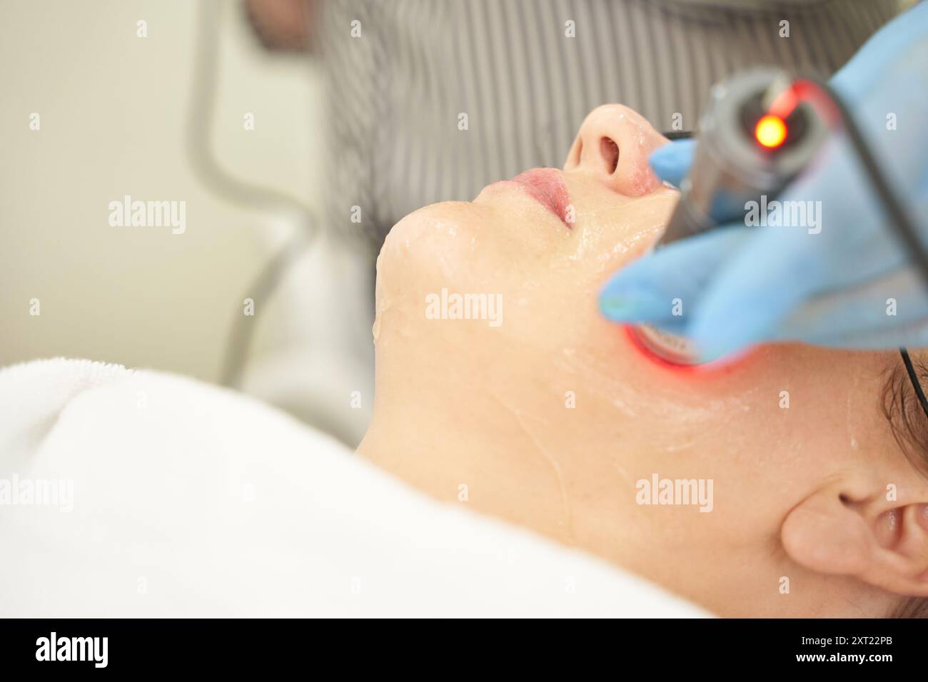 Light infrared therapy. Cosmetology head procedure. Beauty woman face ...