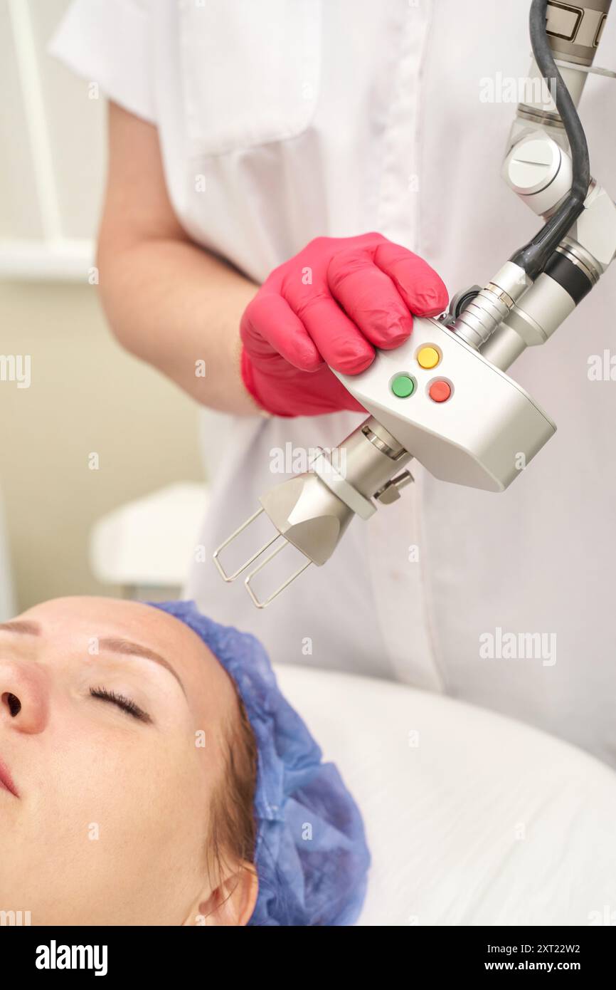 Face procedure. Professional dermatologist uses modern technology for ...