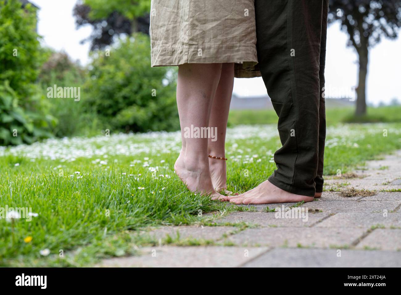 Female walking barefoot in grass hi-res stock photography and images ...