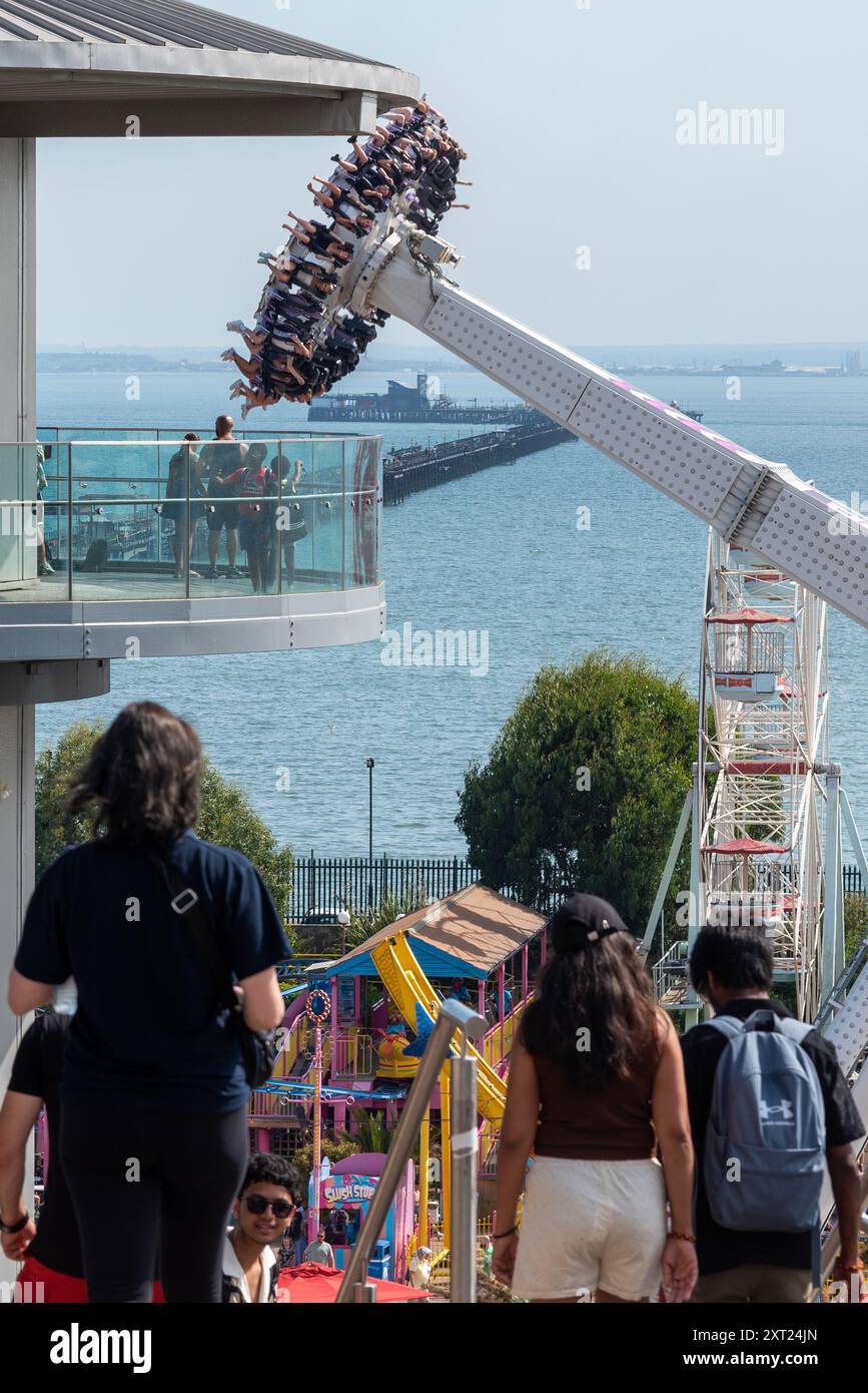 People heading to the seafront of Southend on Sea, Essex, UK, with ...