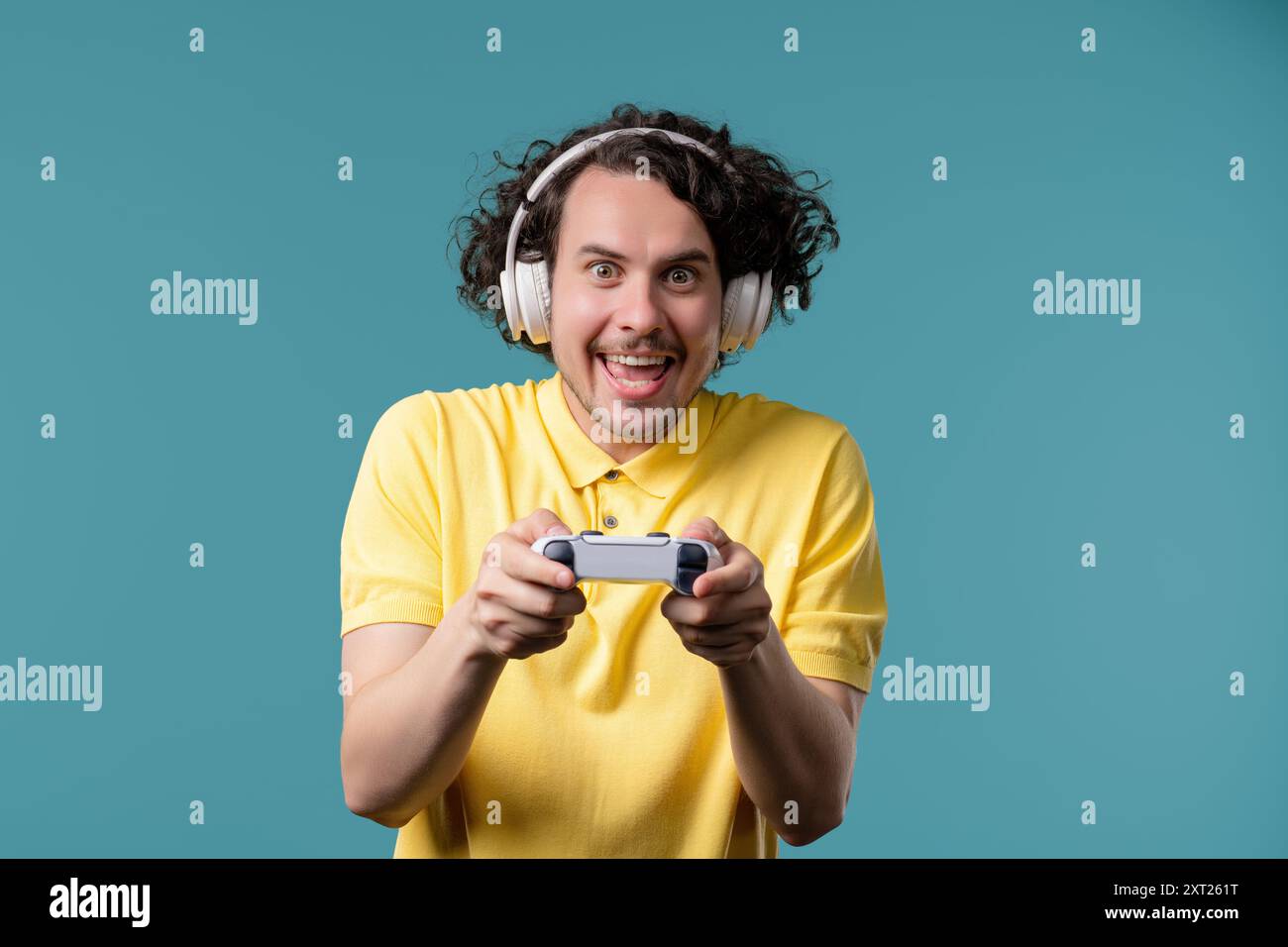 Excited gamer man playing, winning online video game on console with ...