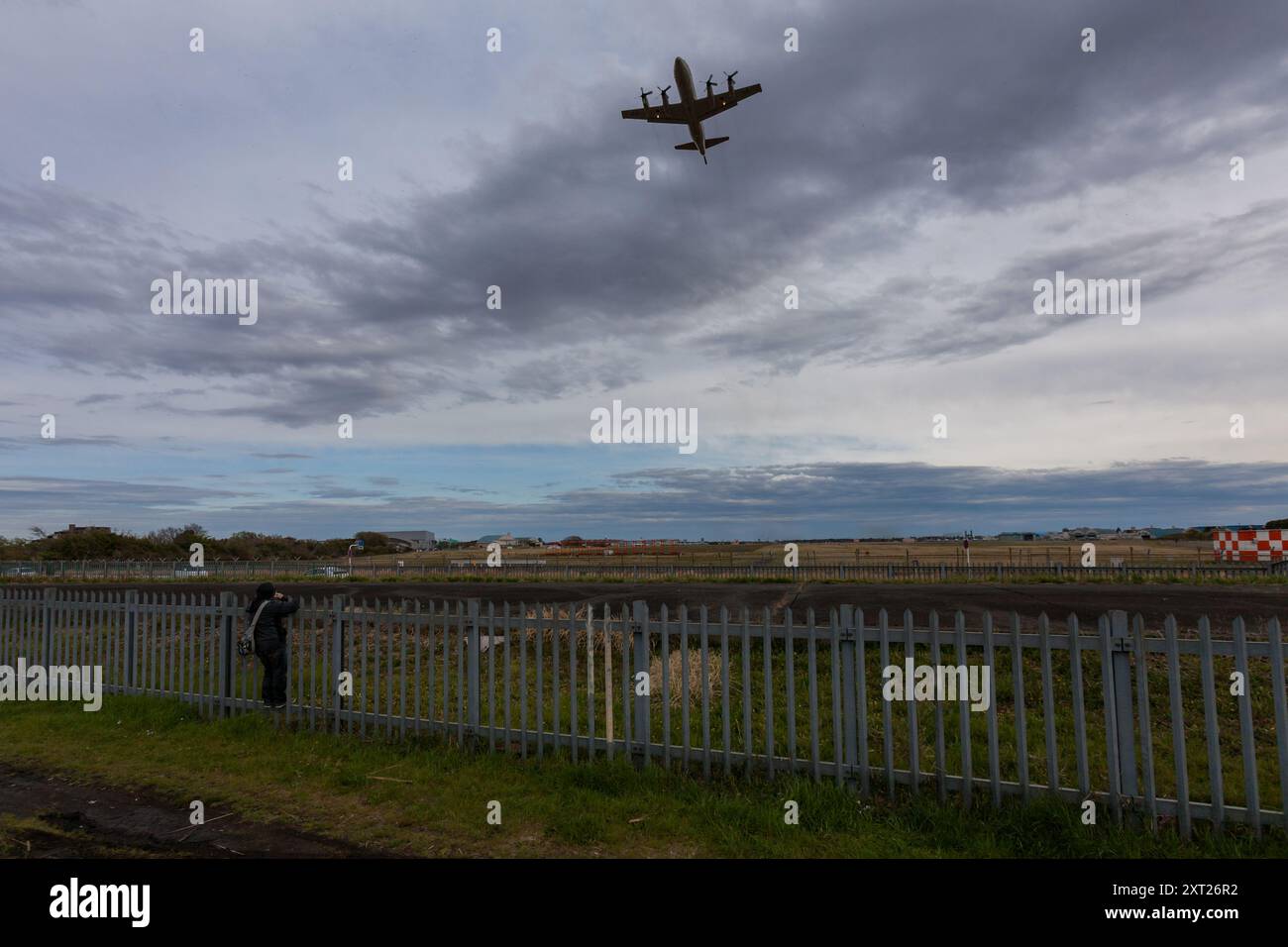 A military aircraft enthusiast watches a Lockheed P-3C Orion Maritime ...