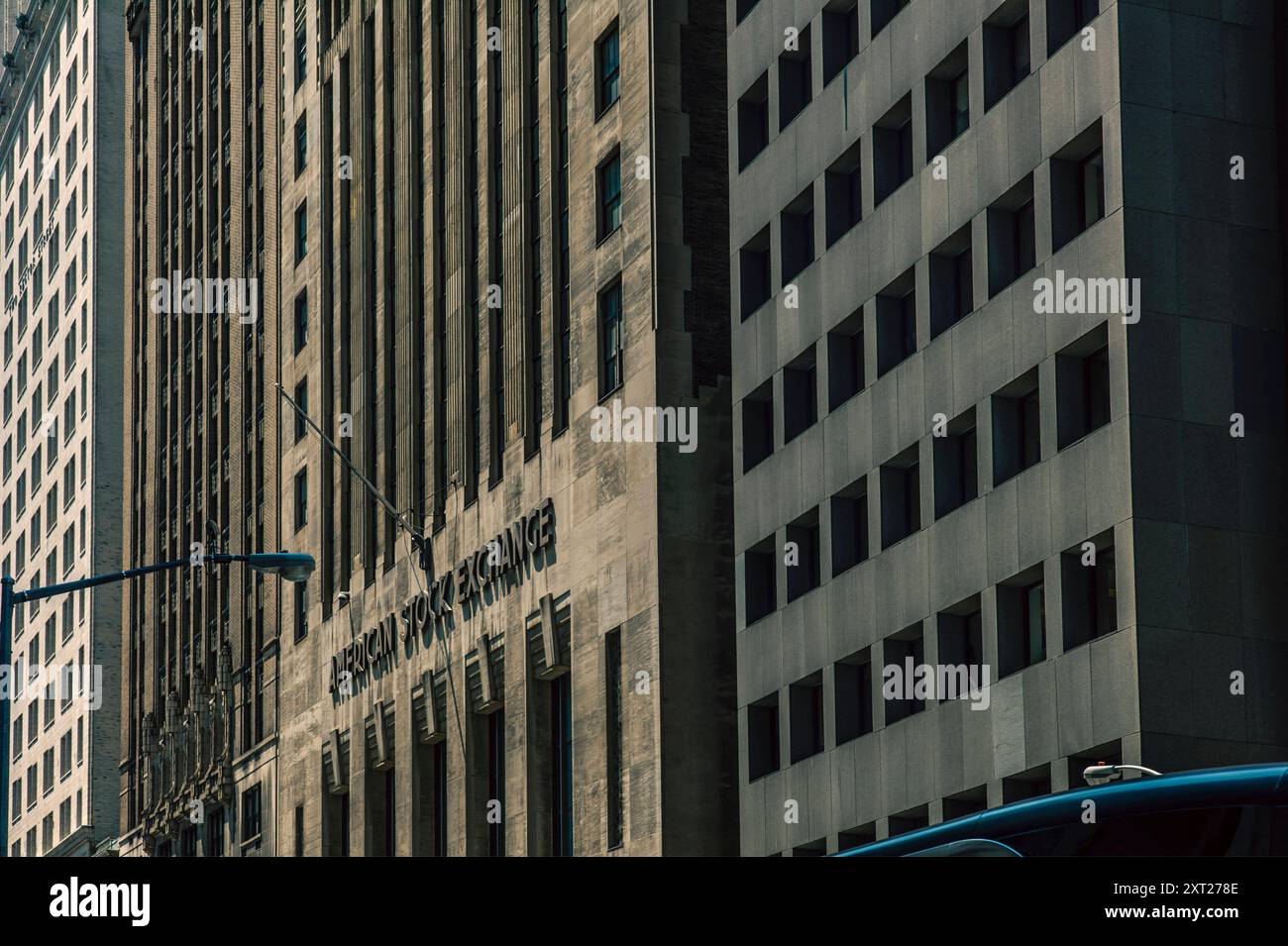 High-rise buildings frame a city street with one featuring the signage ...