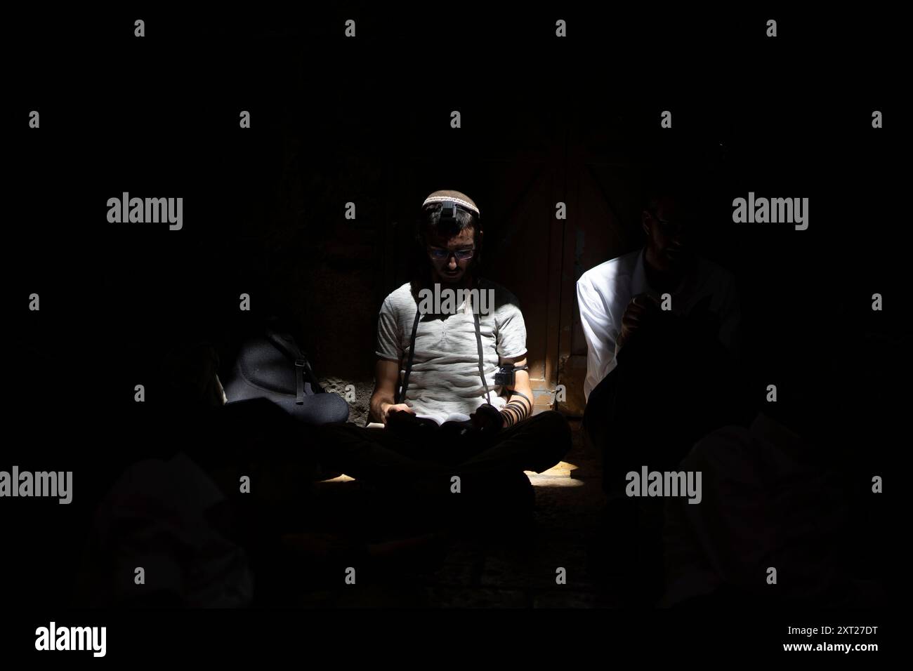An ultra-orthodox Jewish man prays during the mourning ritual of Tisha ...