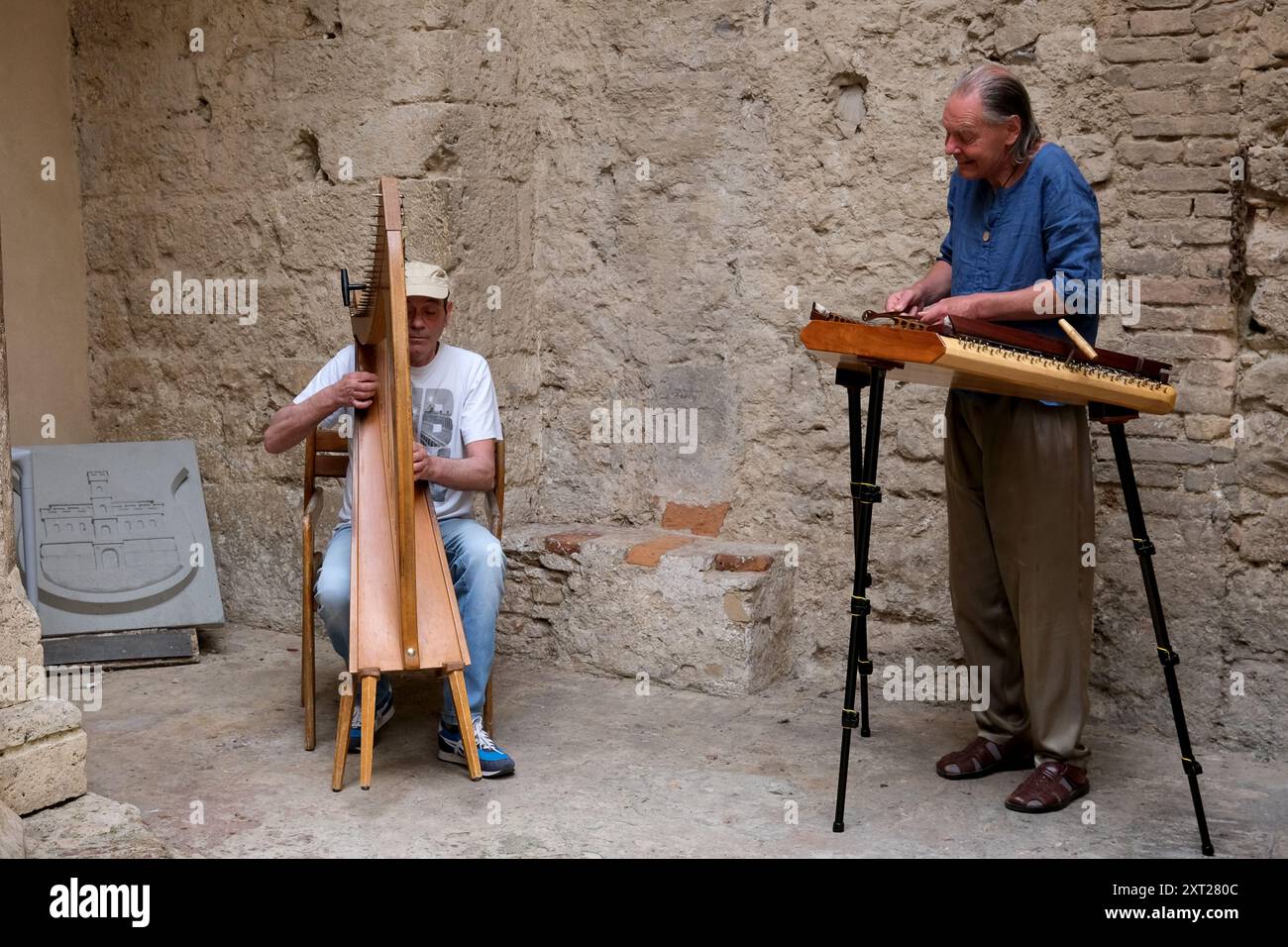 San Gimignano in Tuscany, Italy, musicians playing historic instruments ...