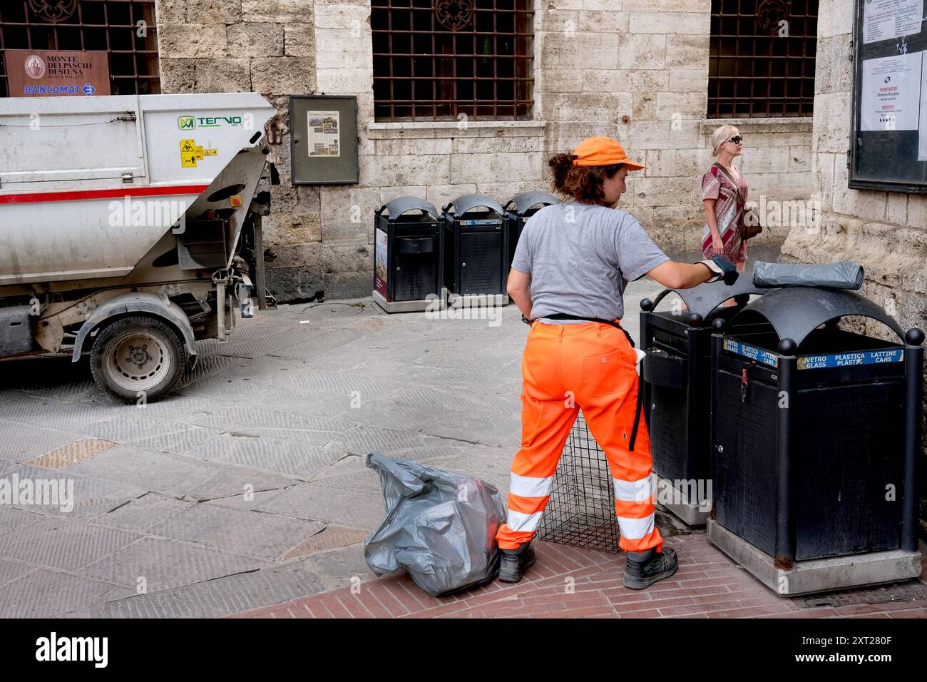 Female woman refuse collector in San Gimignano in Tuscany, Italy Stock ...