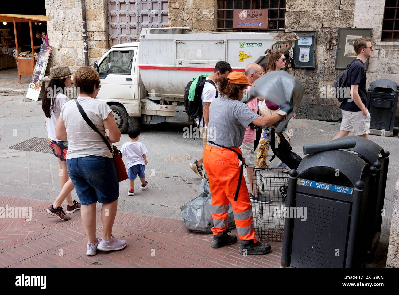 Female woman refuse collector in San Gimignano in Tuscany, Italy Stock ...