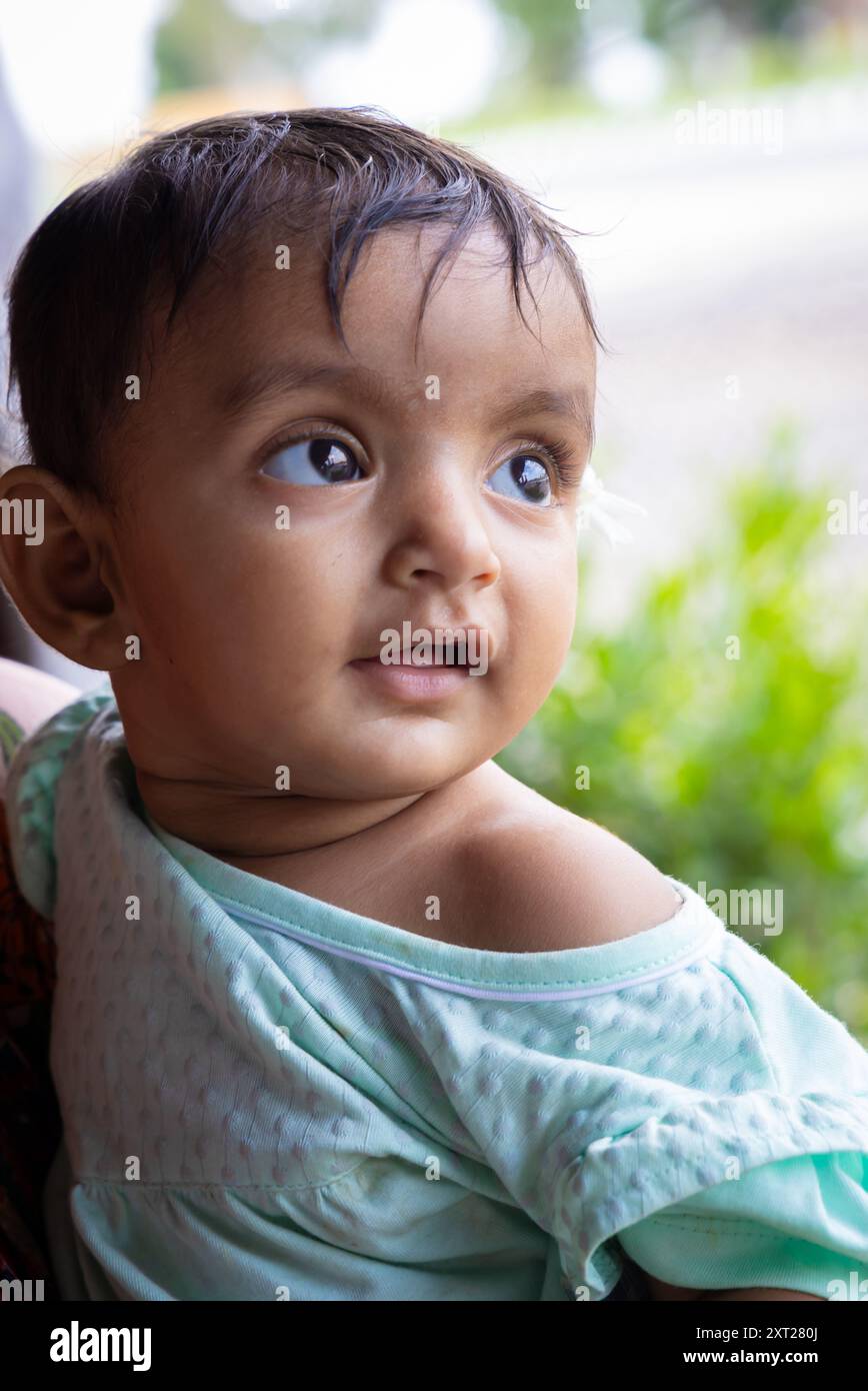 cute toddler innocent facial close up shot at outdoor at day from flat ...