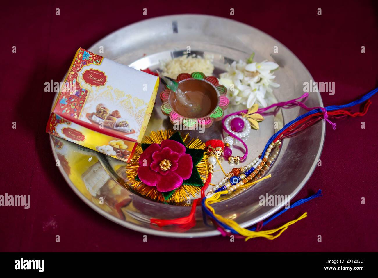 isolated plate decorated with holy thread rakhi at hindu raksha bandhan ...