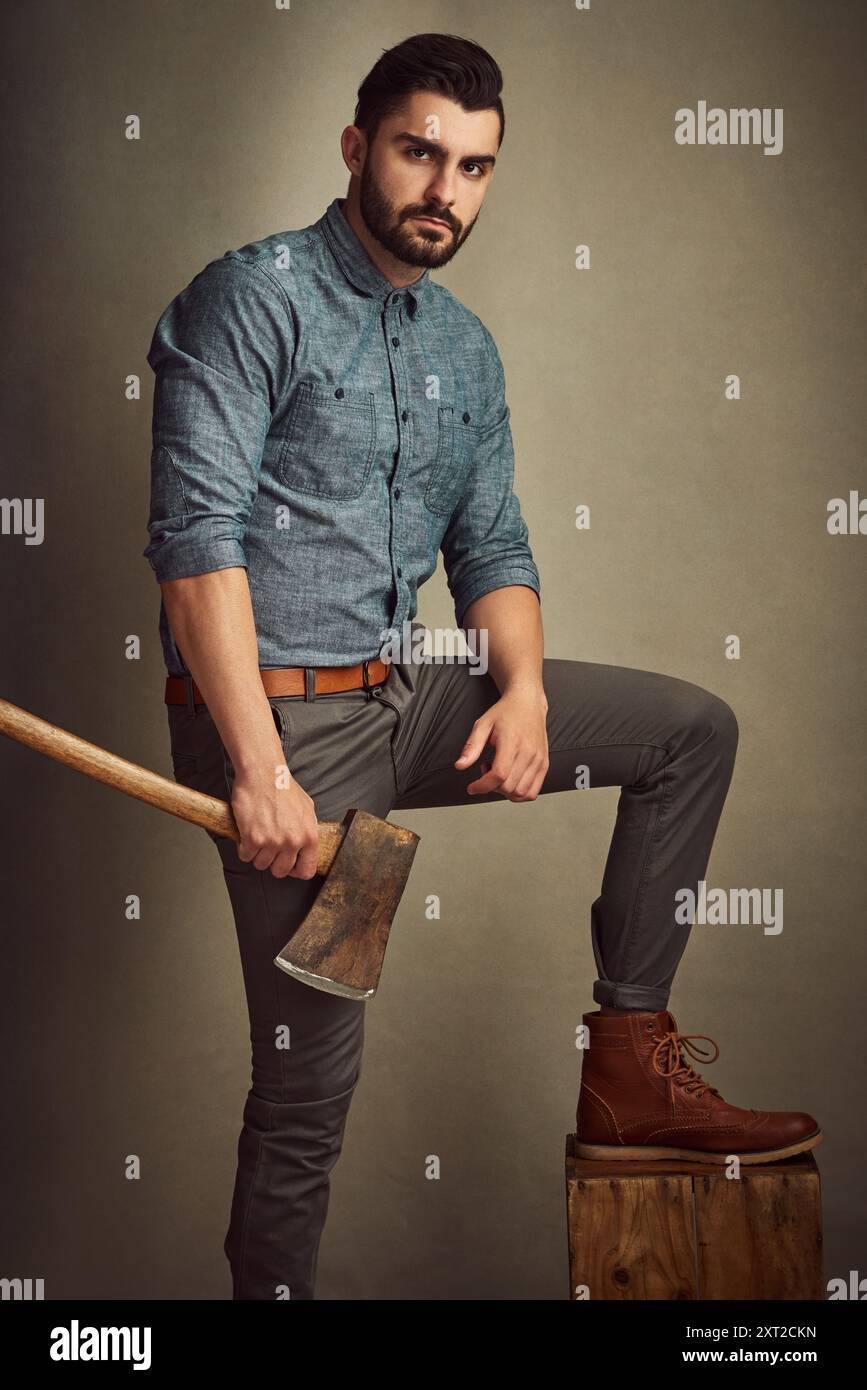 Lumberjack, studio background and portrait of man with axe for timber ...
