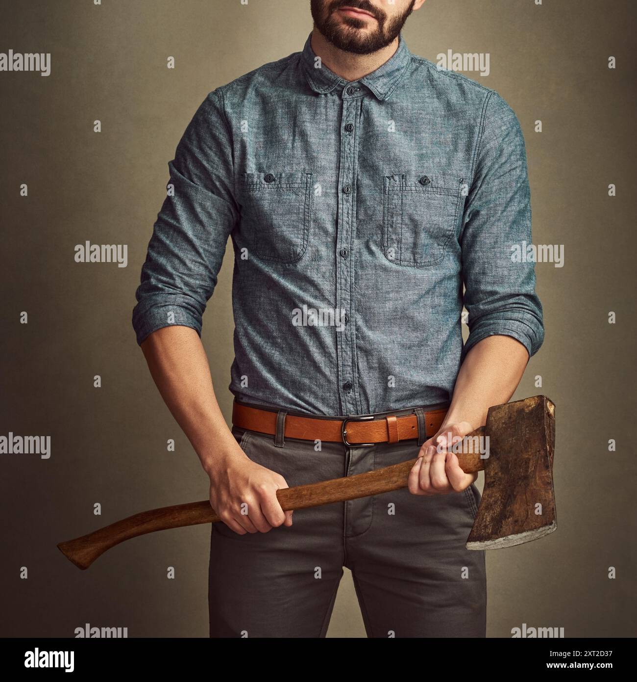 Man, hands and carpenter axe on studio background, confident and ...