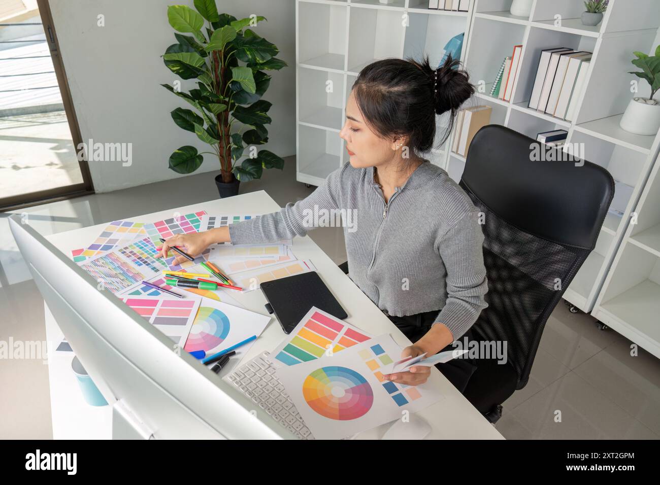 Talented Graphic Designer Working on Color Palettes and Design Projects ...