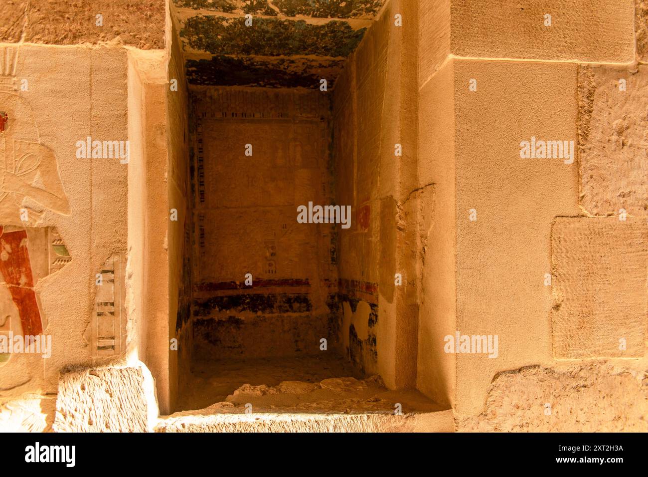 A narrow, dimly lit passageway leads to a hidden chamber within the ...