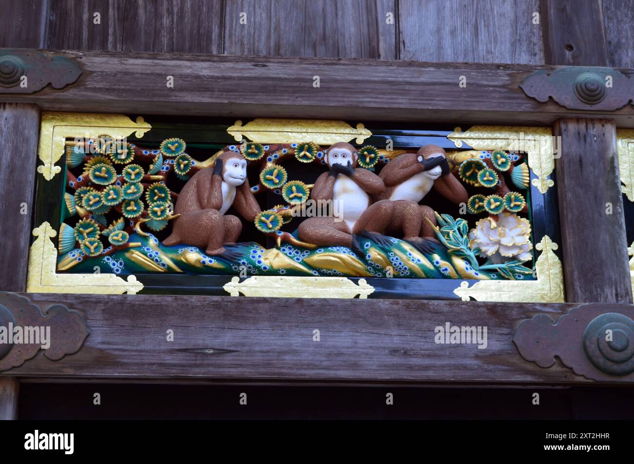 A close-up photography of the three famous monkeys carved in wood in a ...