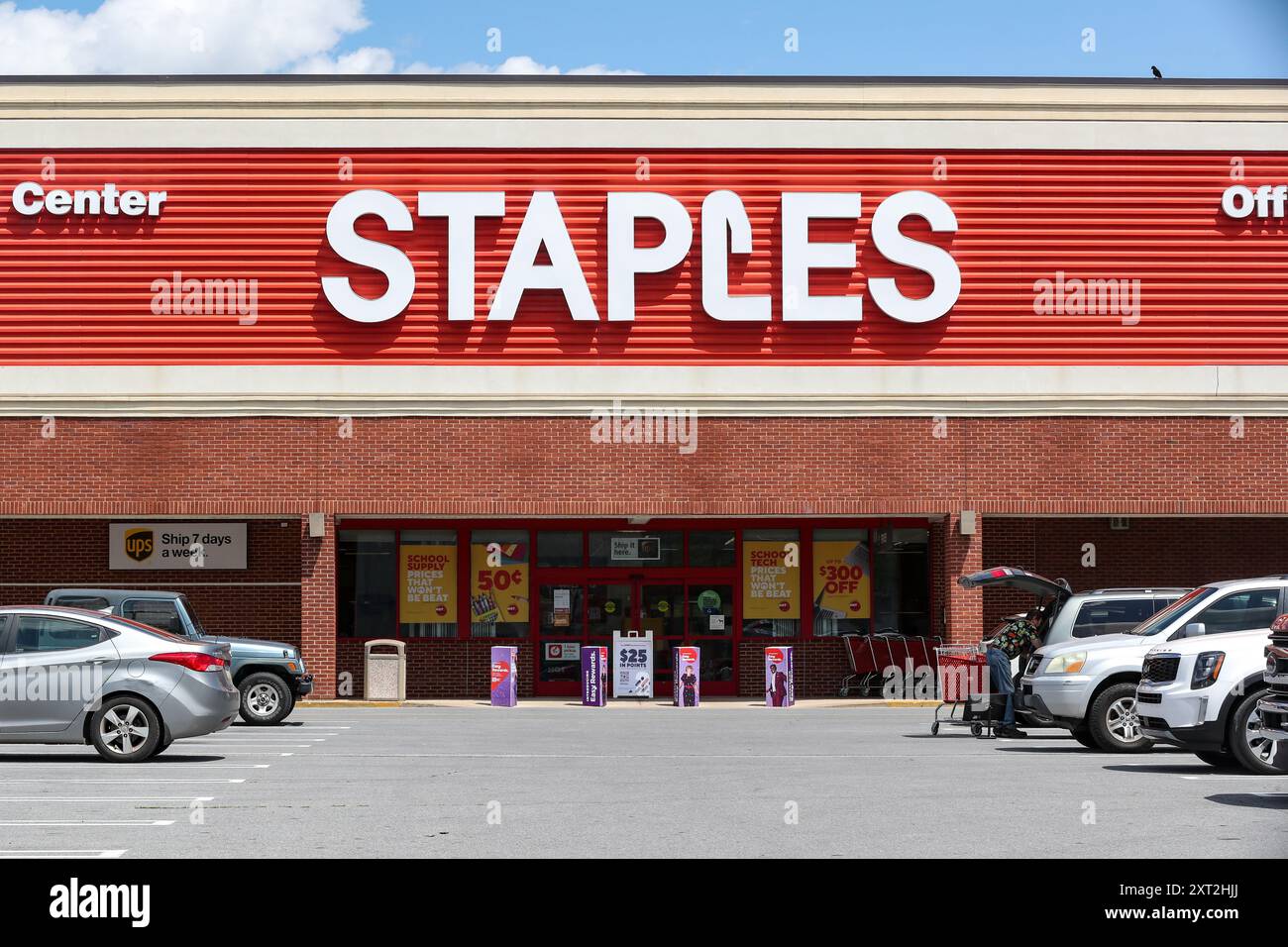 The Staples logo is seen above the entrance to one of its stores. Staples, Inc. is a privately ...