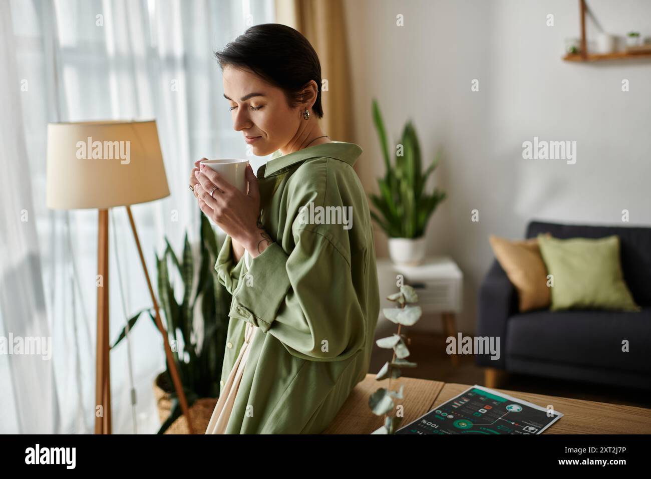 Beautiful young woman sips coffee hi-res stock photography and images ...