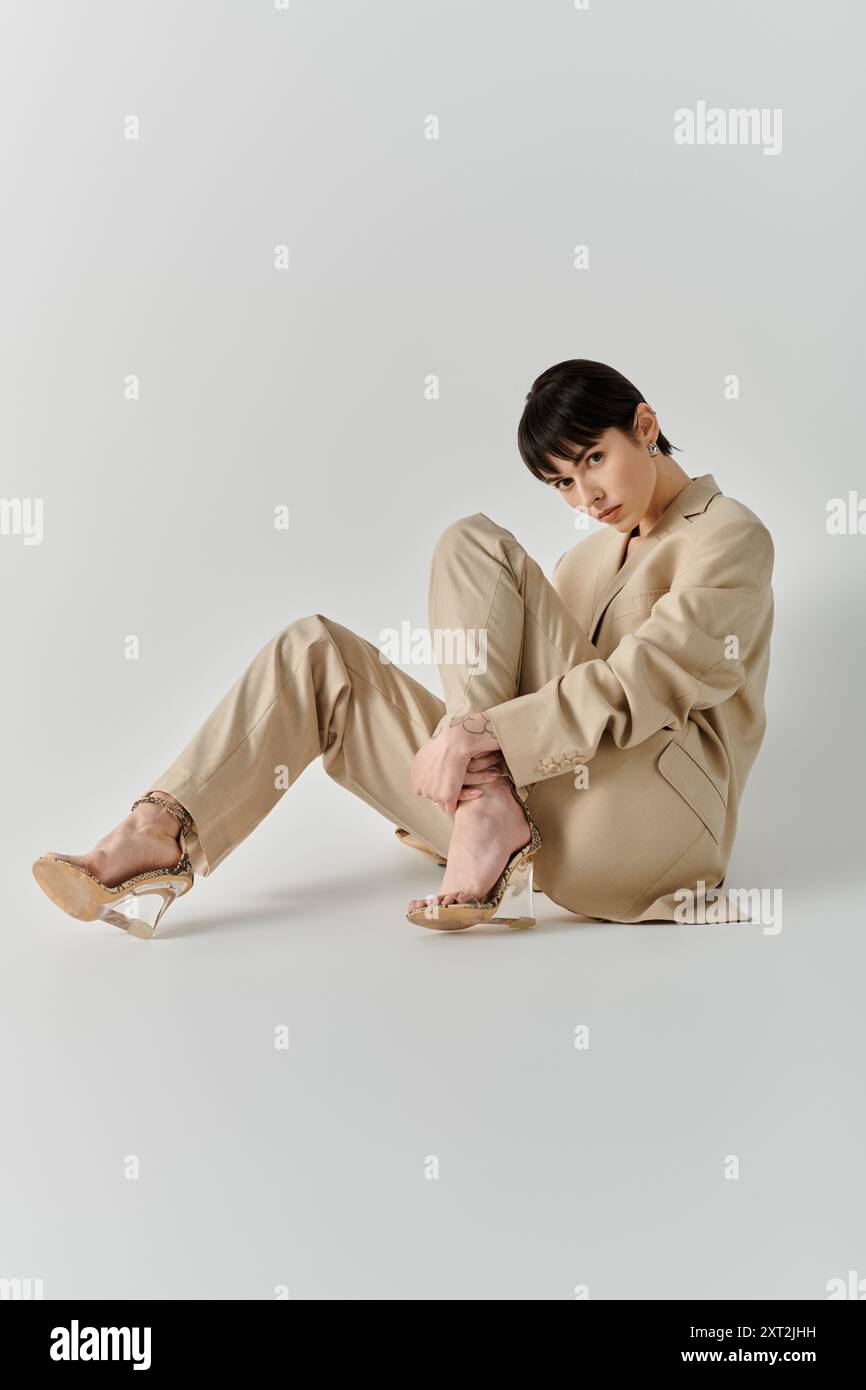 Woman legs crossed high heels hi-res stock photography and images - Alamy