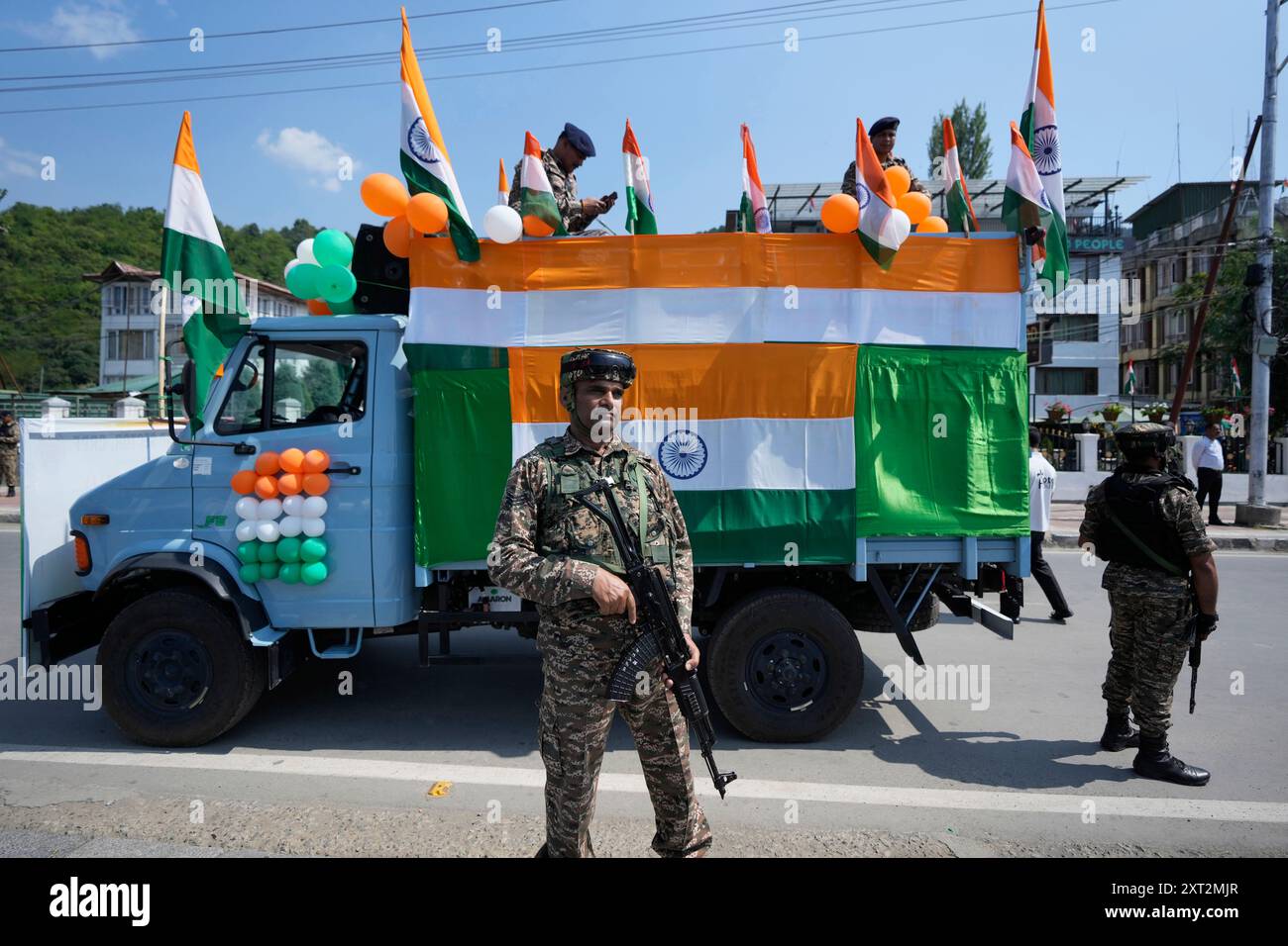 Indian paramilitary soldiers guard during a motorcycle rally displaying ...