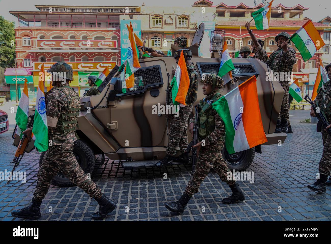 Indian paramilitary soldiers march displaying the Indian flag ahead of ...