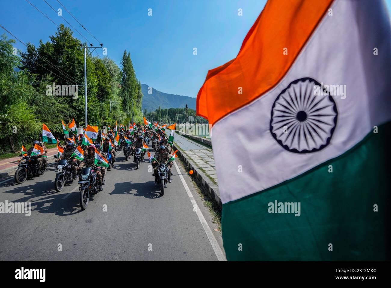Indian paramilitary officers participate during a motorcycle rally ...