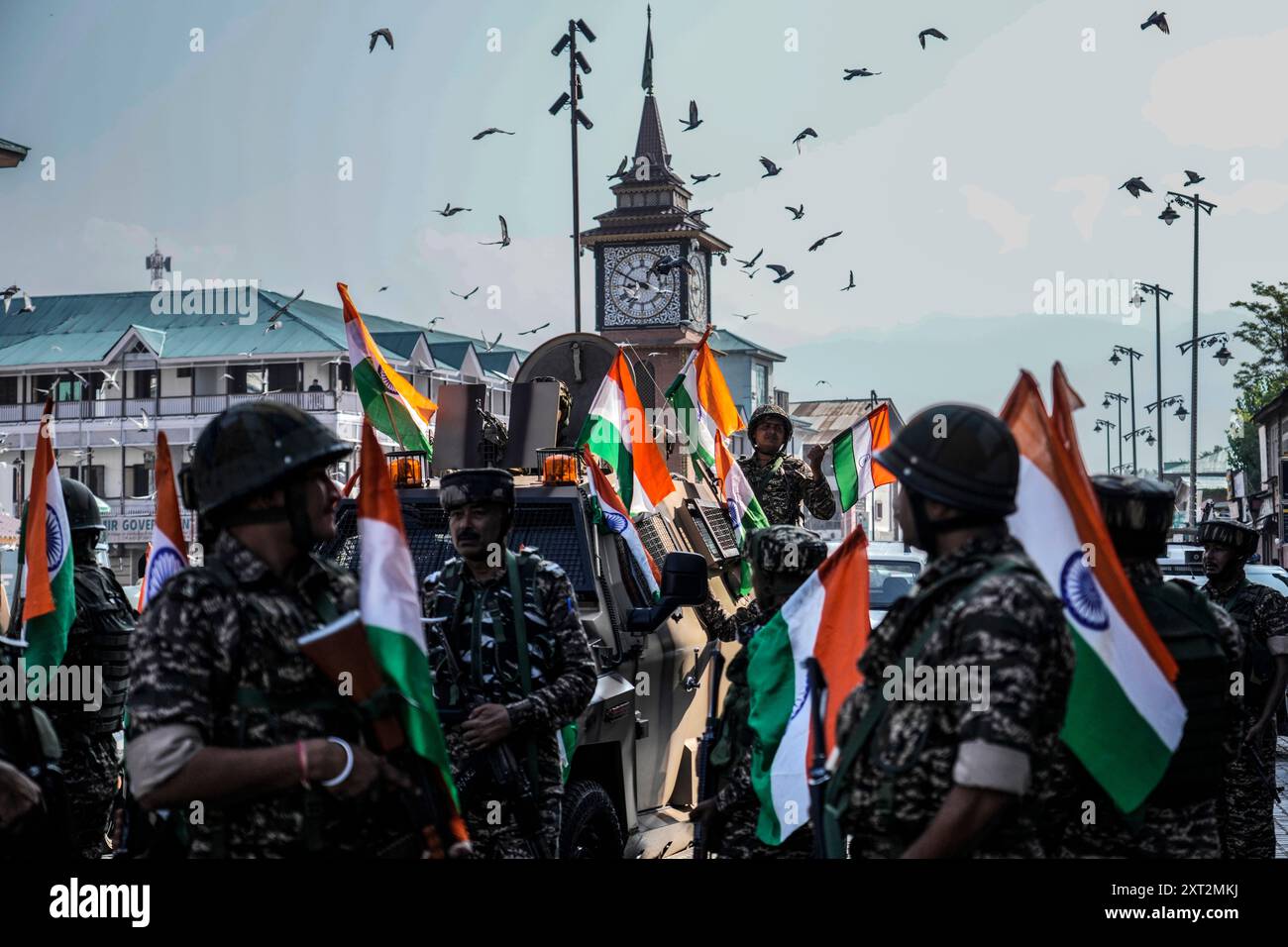 Indian paramilitary soldiers march displaying the Indian flag ahead of ...