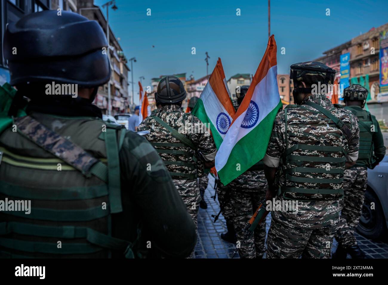 Indian paramilitary soldiers march displaying the Indian flag ahead of ...