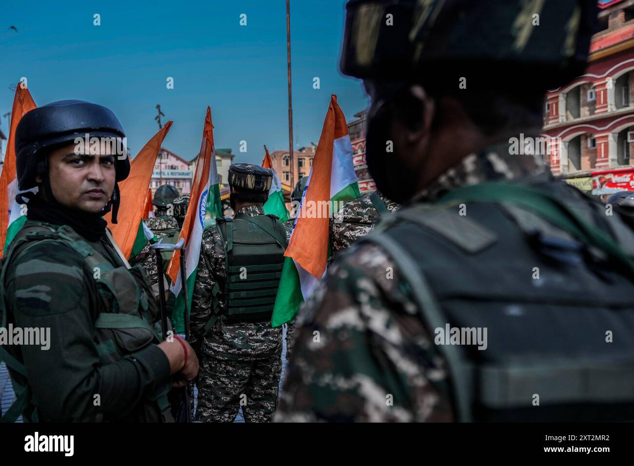 Indian paramilitary soldiers march displaying the Indian flag ahead of ...