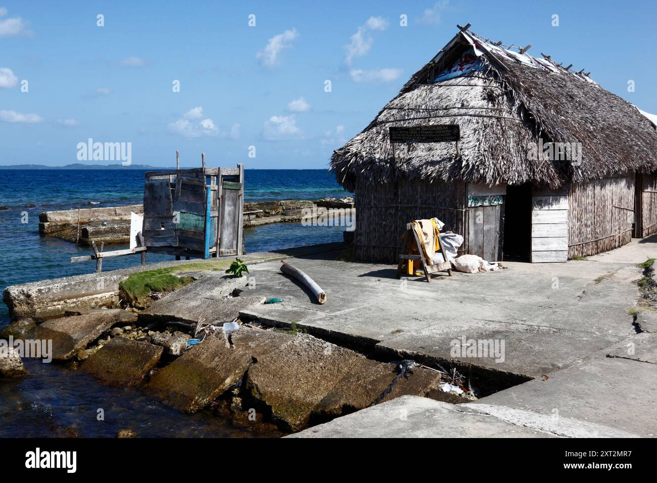 Typical house made of bamboo and thatched with palm leaves. The wooden ...