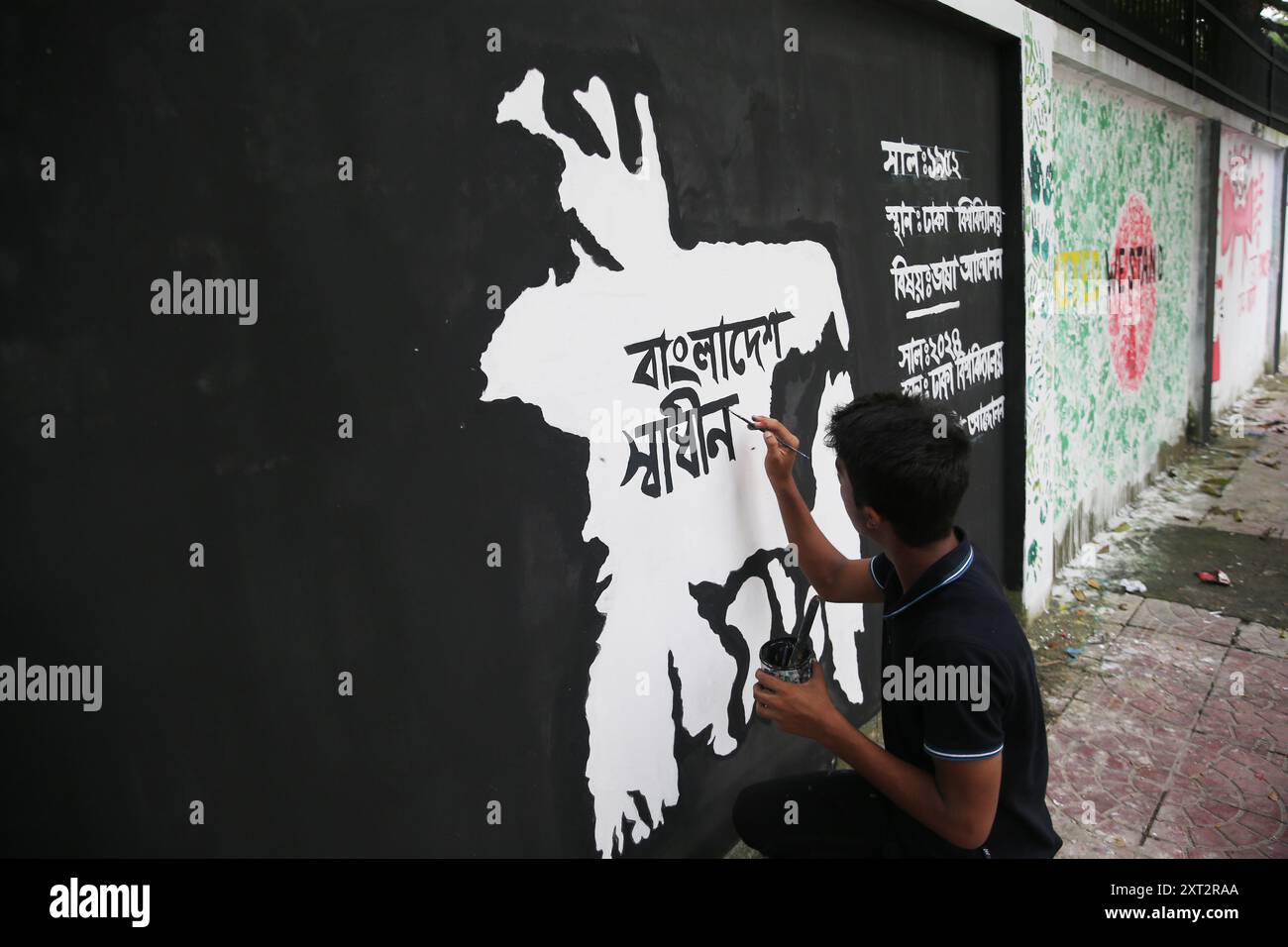 August 13, 2024, Dhaka, Wari, Bangladesh: A student paints a new ...