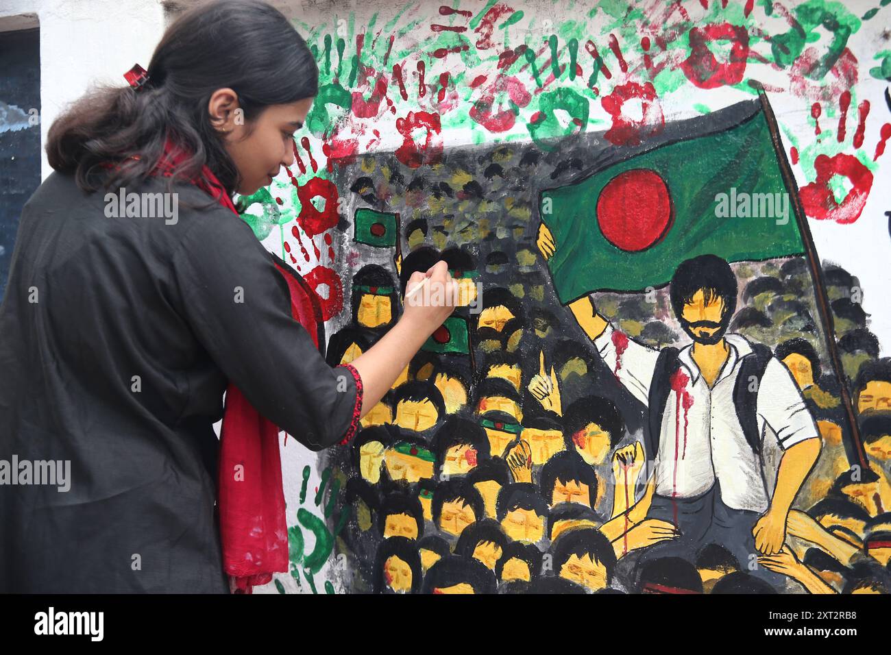 August 13, 2024, Dhaka, Wari, Bangladesh: A student paints a new ...