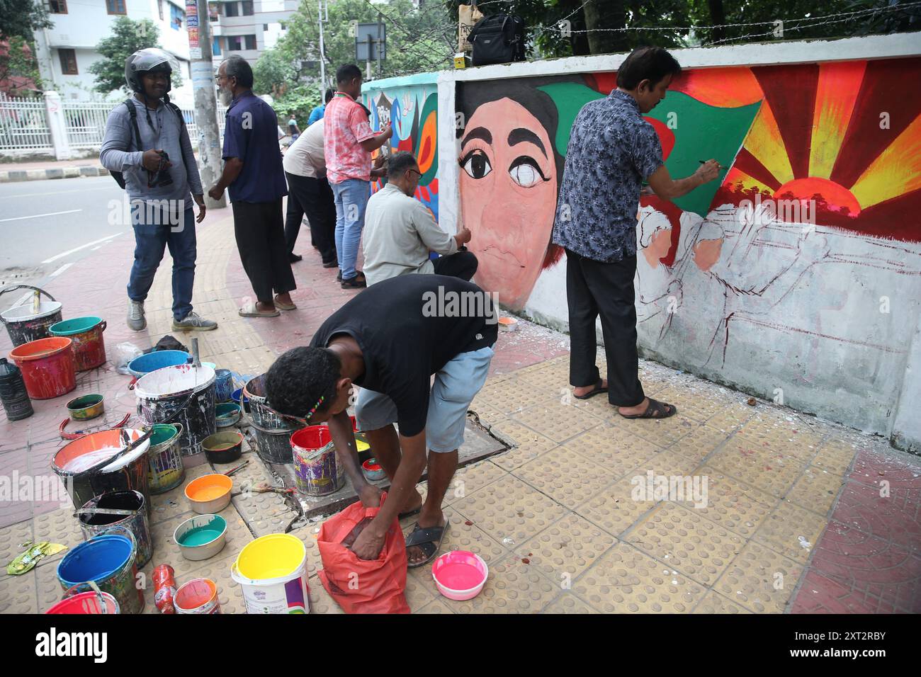 August 13, 2024, Dhaka, Wari, Bangladesh: A student paints a new ...