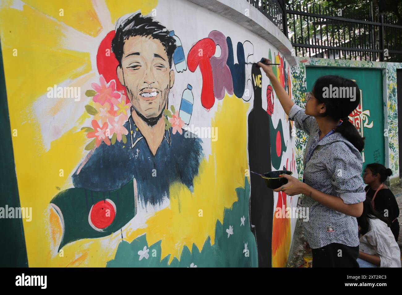 August 13, 2024, Dhaka, Wari, Bangladesh: A student paints a new ...