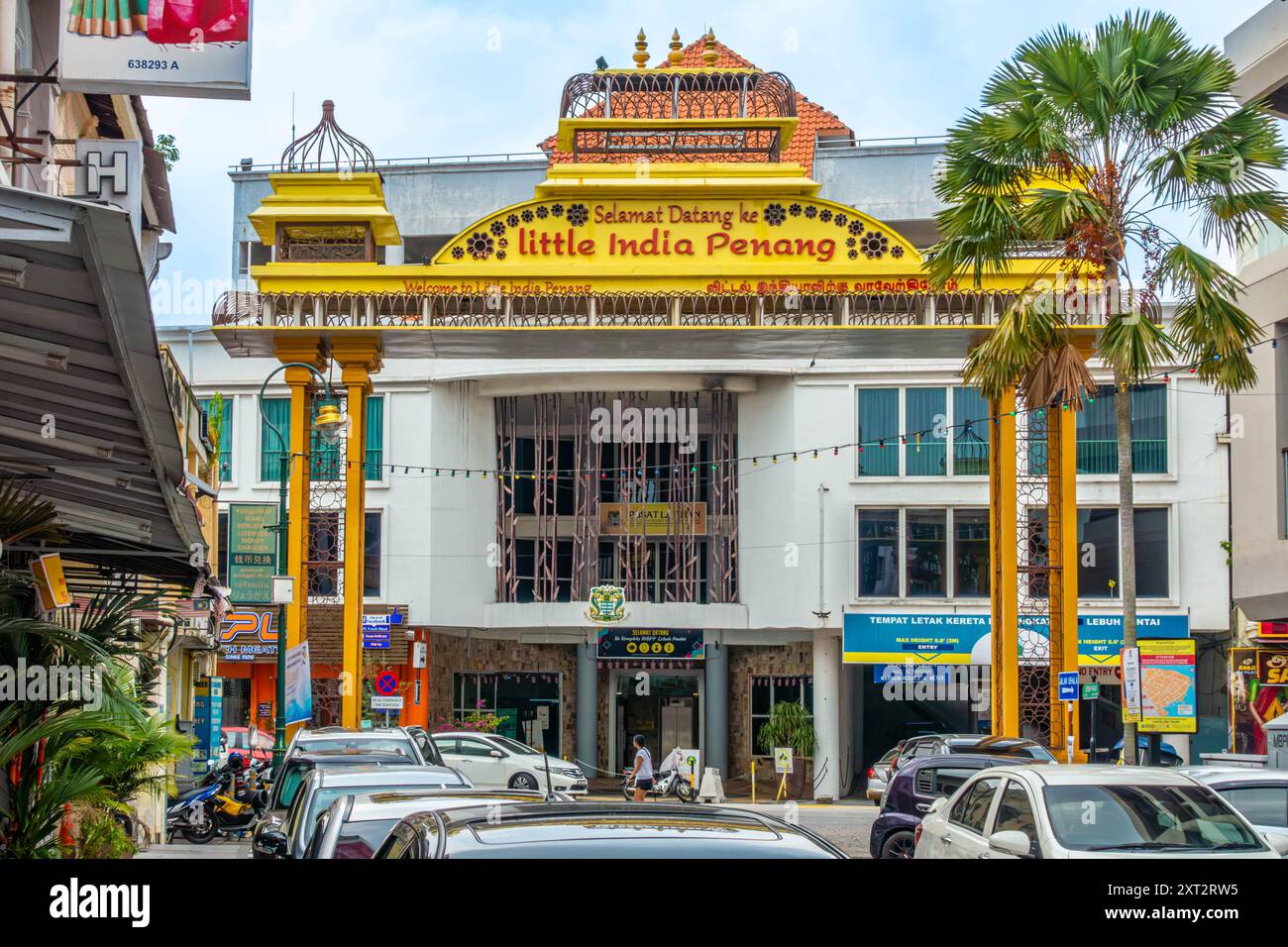 A large yellow gateway spans market street at the entrance to Little ...